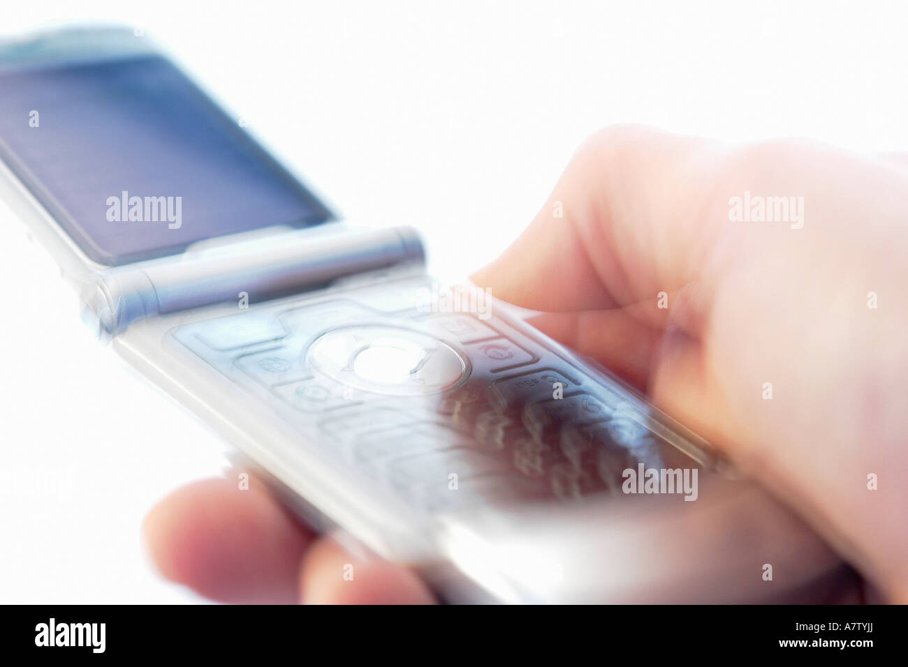 Close-up of person's hand holding flip phone Stock Photo - Alamy