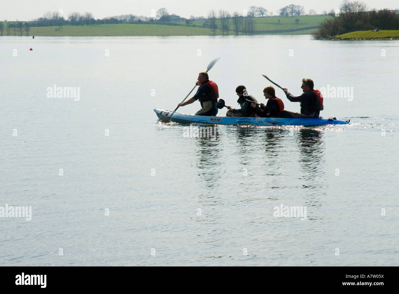 A kiak with four people rowing Rutland Water Stock Photo - Alamy