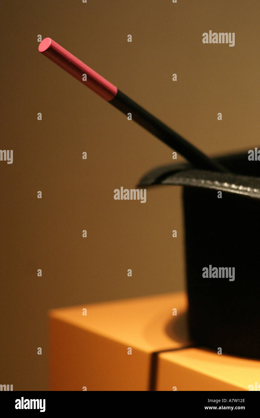 magic wand in top hat vertical Stock Photo - Alamy