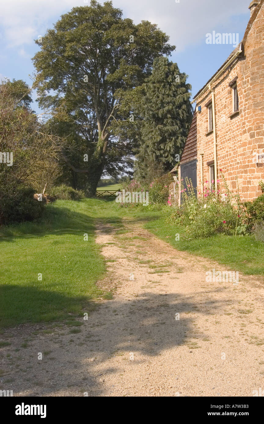 Country lane in the rural village of Little Tew in Oxfordshire Stock ...
