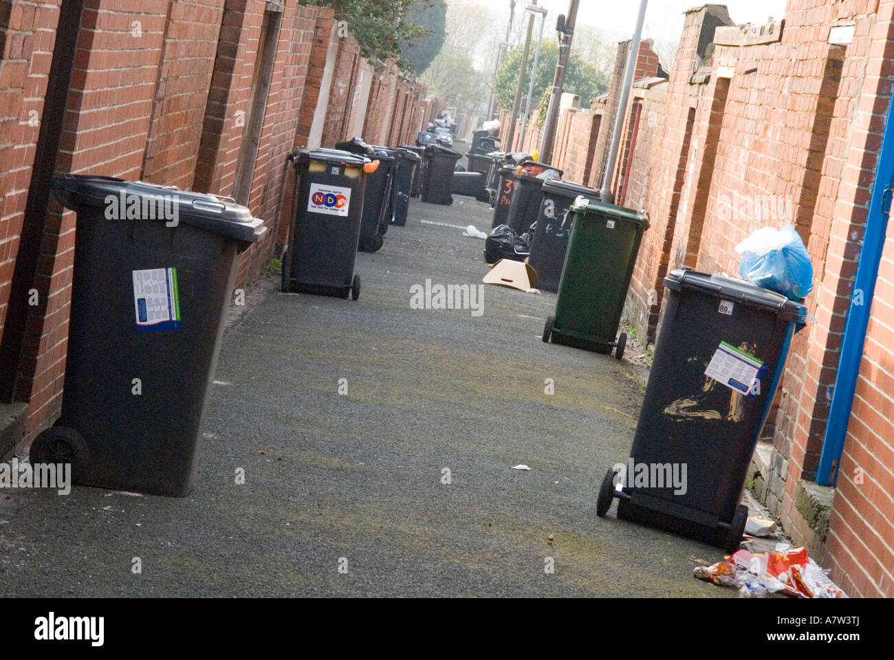 Rubbish Bins in Back Alley Stock Photo - Alamy