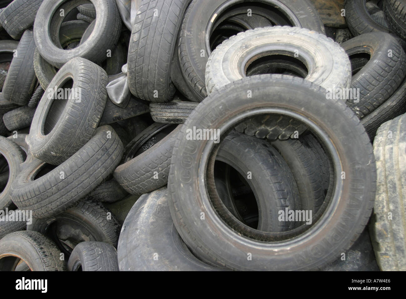 Tyres stacked for recycling Stock Photo - Alamy