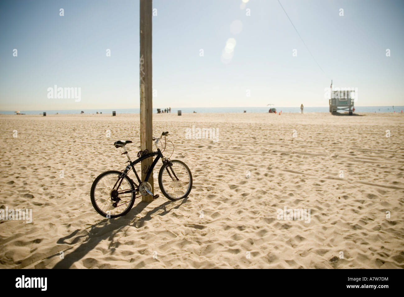 Bicycle chained to electric pole on beach Santa Monica California USA ...