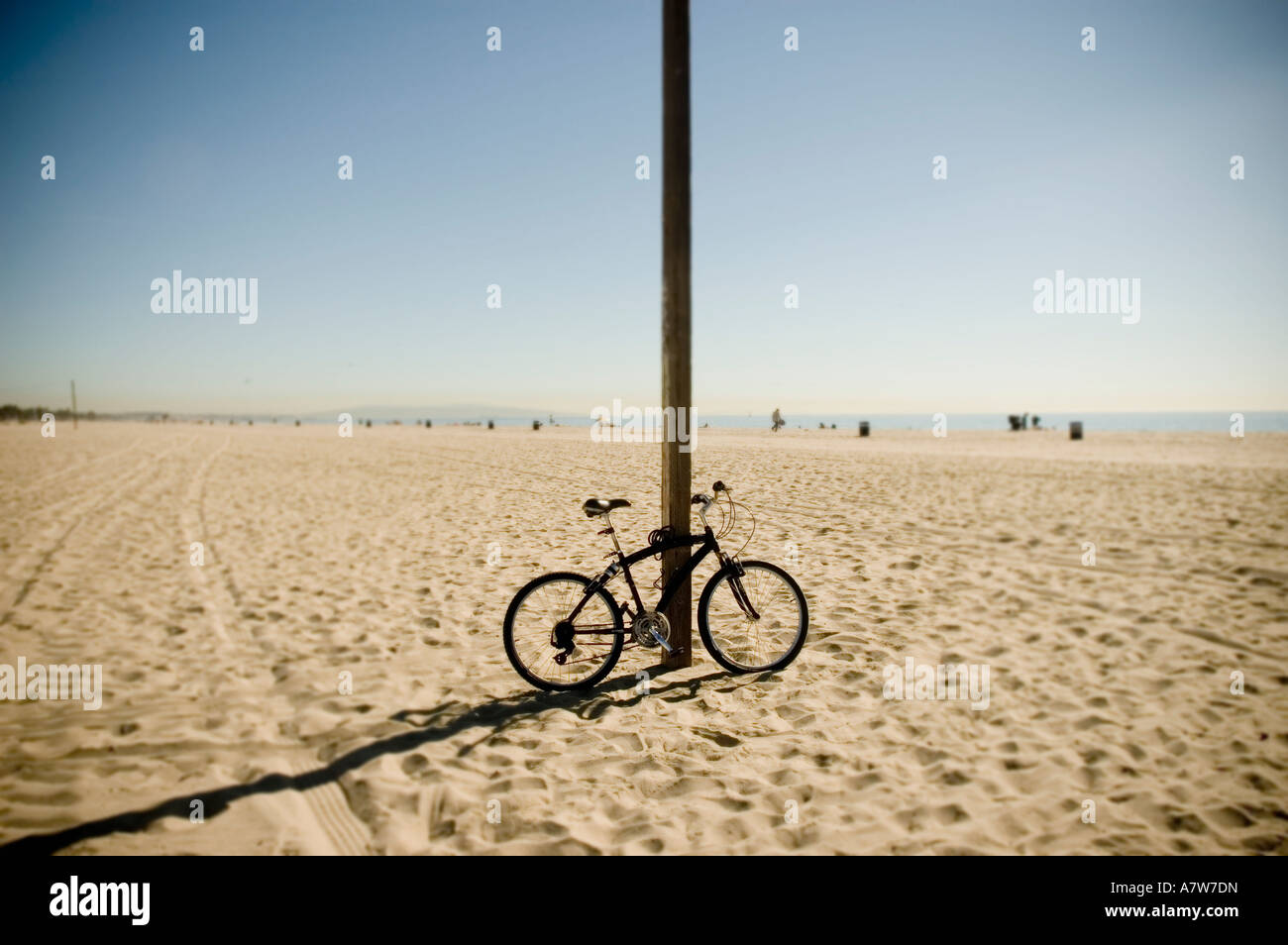 Bicycle chained to electric pole on beach Santa Monica California USA ...