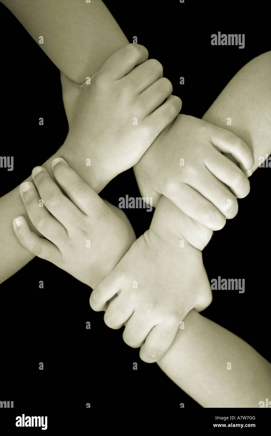 Four friends holding hands arms hi-res stock photography and images - Alamy