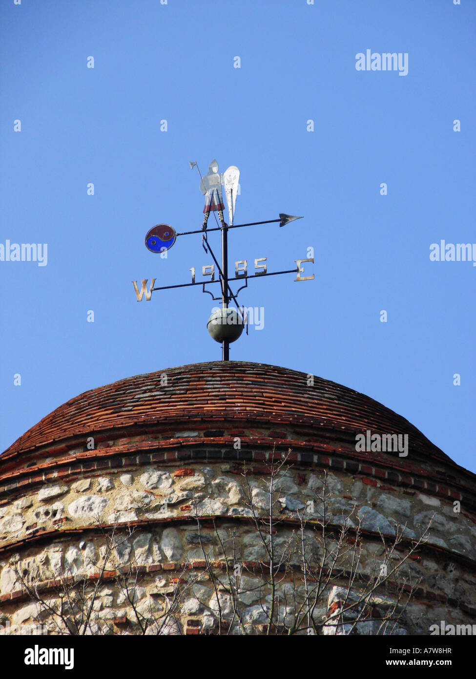 Weathervane with a knight character and the yin and yang symbol on top ...