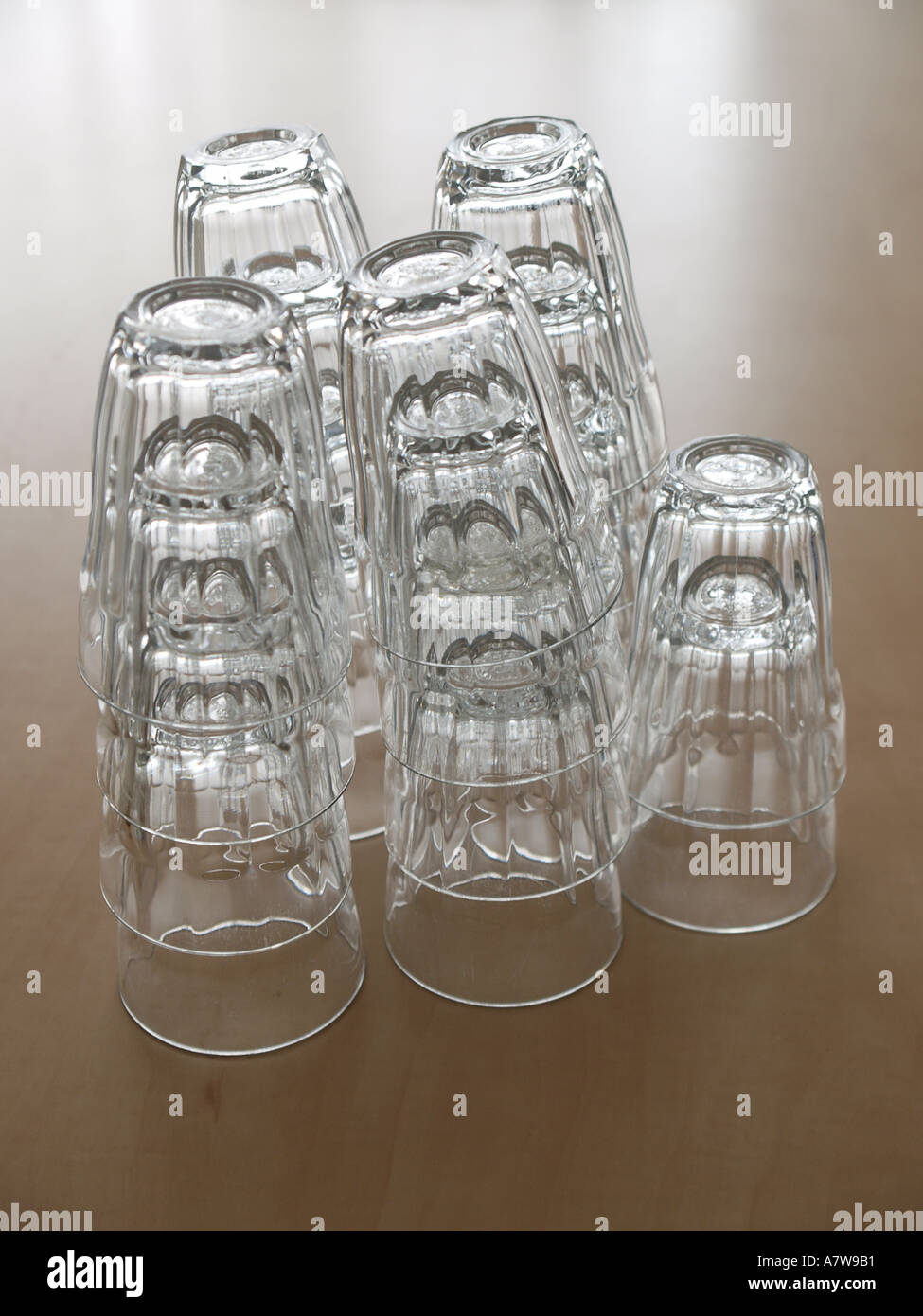 Stacked water glasses on a conference table Stock Photo - Alamy