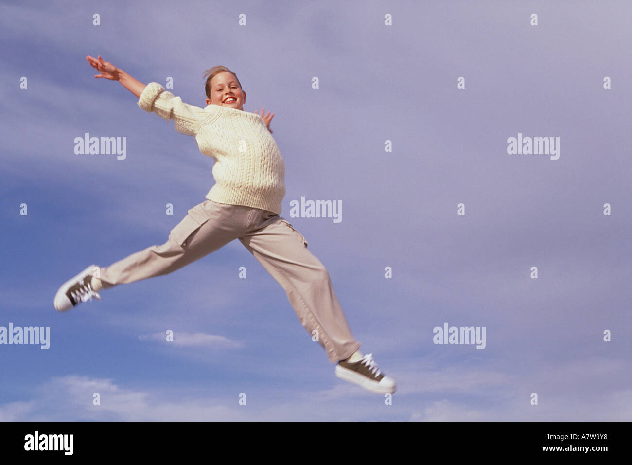 portrait of a girl jumping into the air Stock Photo - Alamy