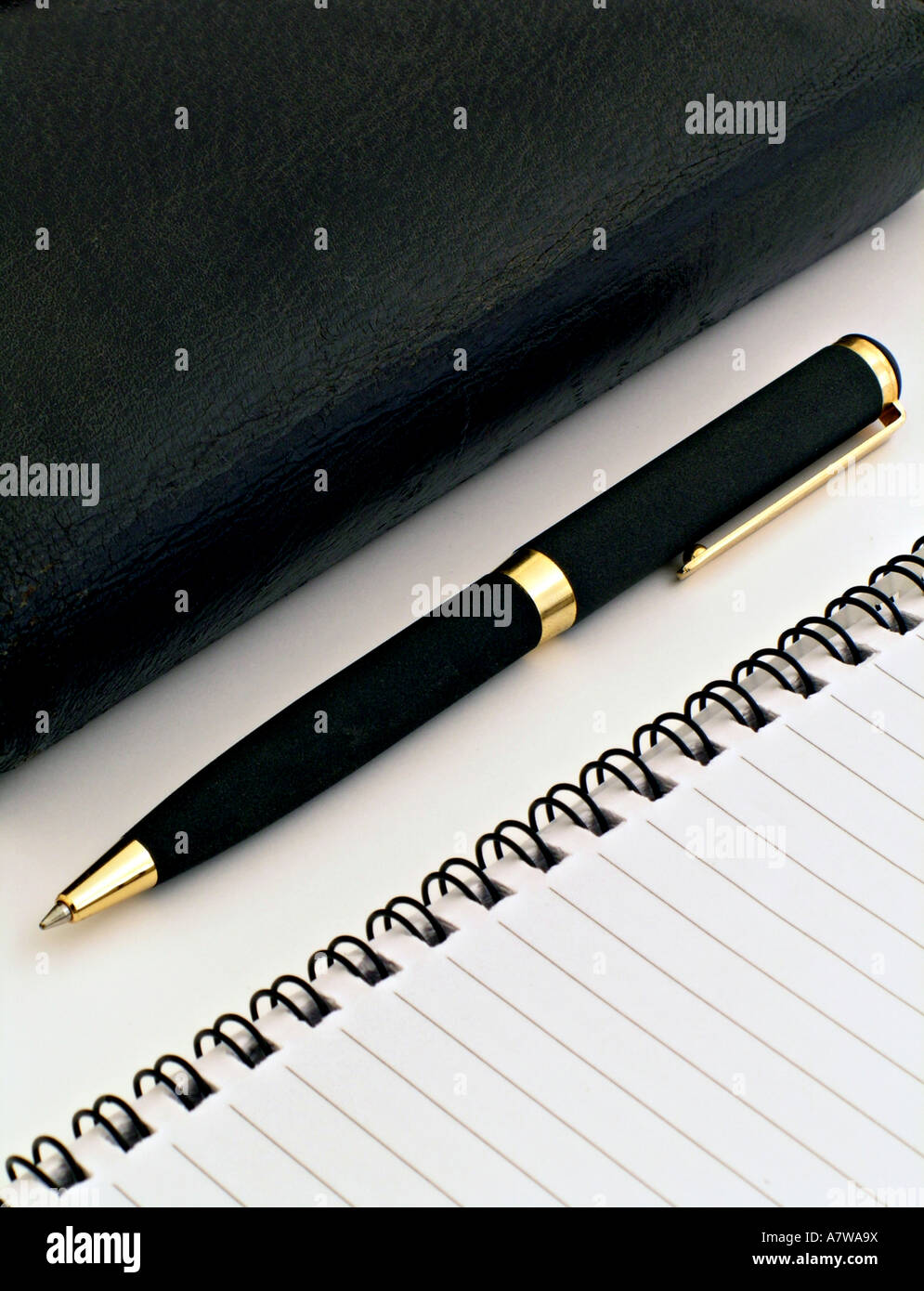 Black leather diary with pen and notepad Stock Photo - Alamy