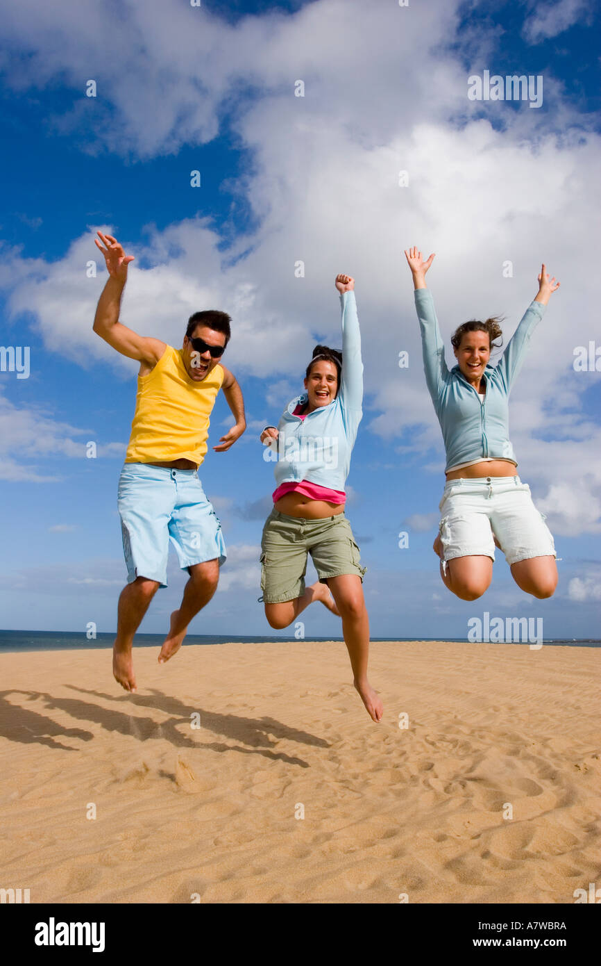 People Jumping On The Sand