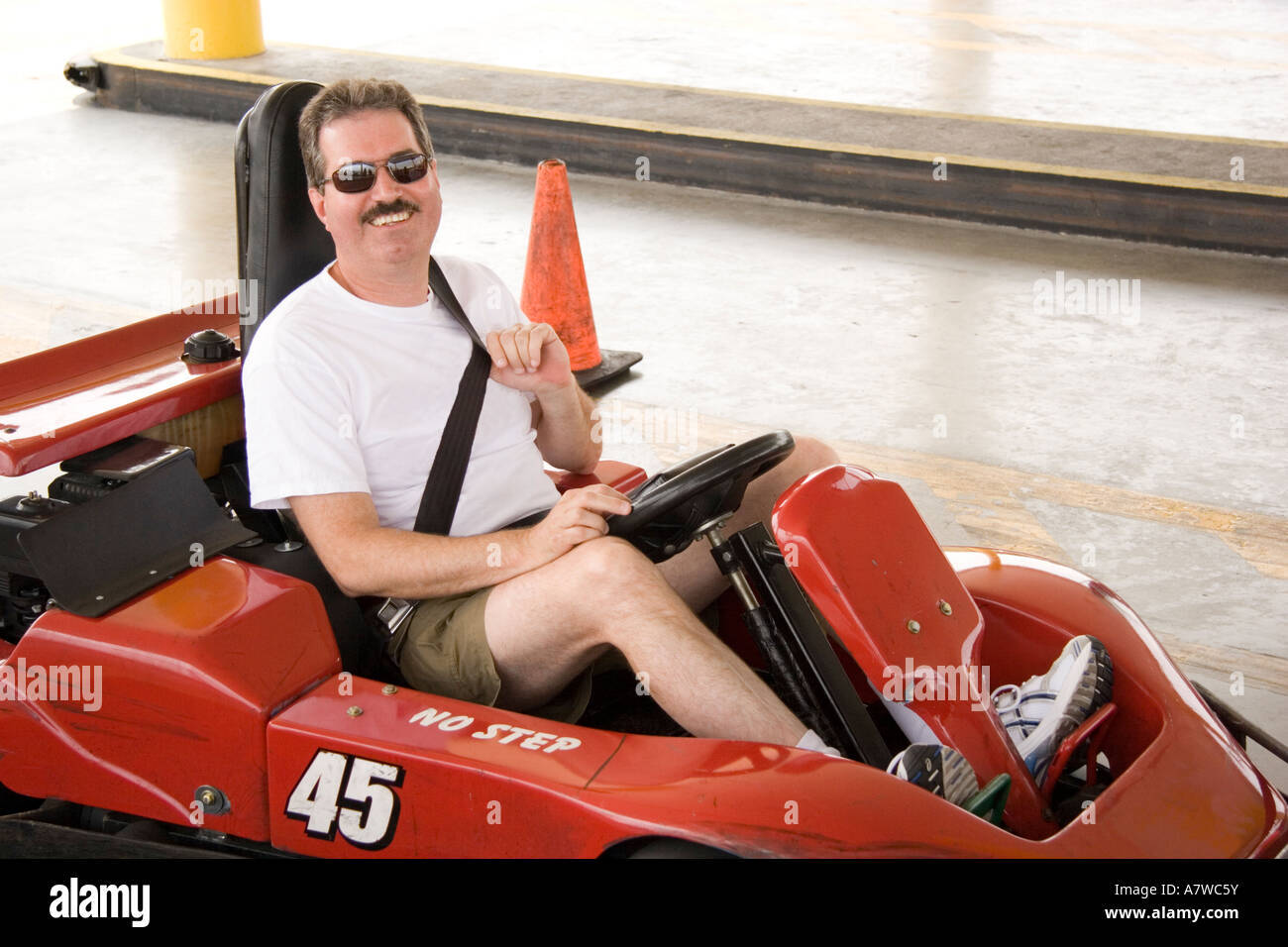 Man enjoying go-carting Stock Photo - Alamy