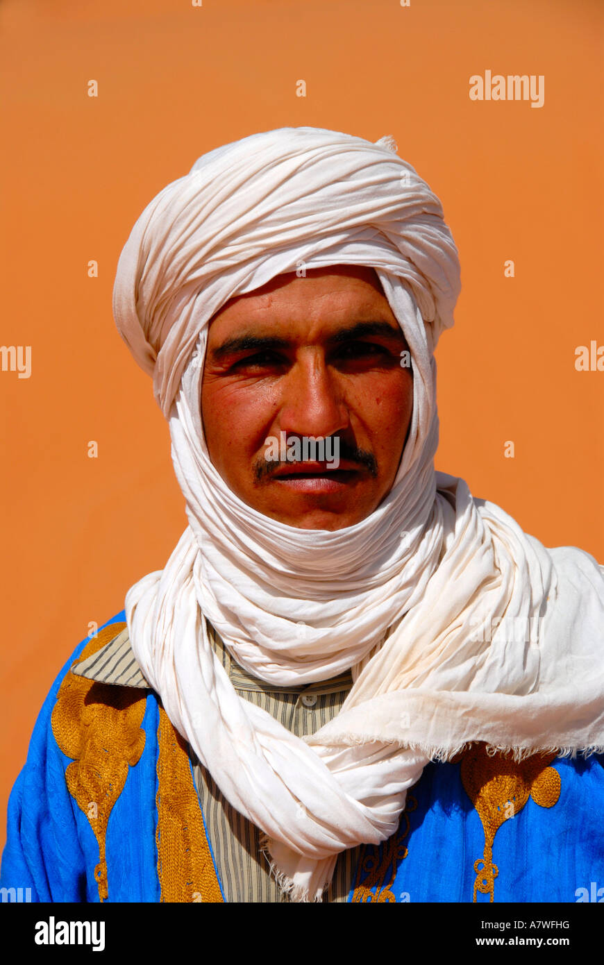 Portrait Tuareg dressed in blue robe and white turban Erg Chebbi ...