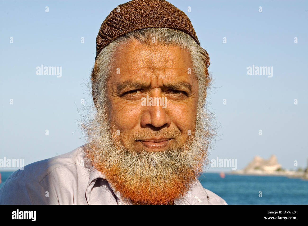 Portrait man with a gray and red beard in the bachground Muscat Oman ...