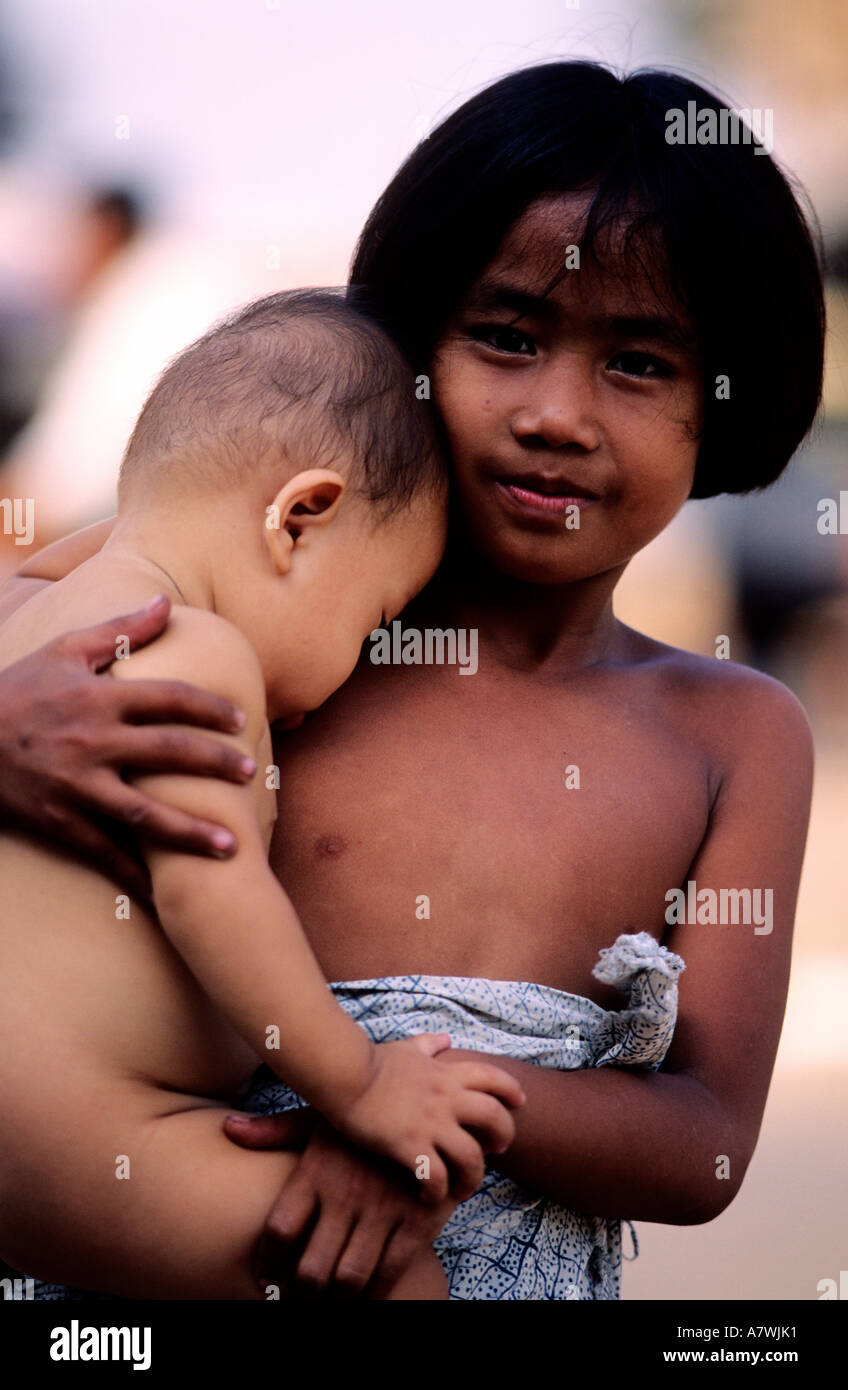 Cambodia, Phnom Penh, child with a baby Stock Photo - Alamy