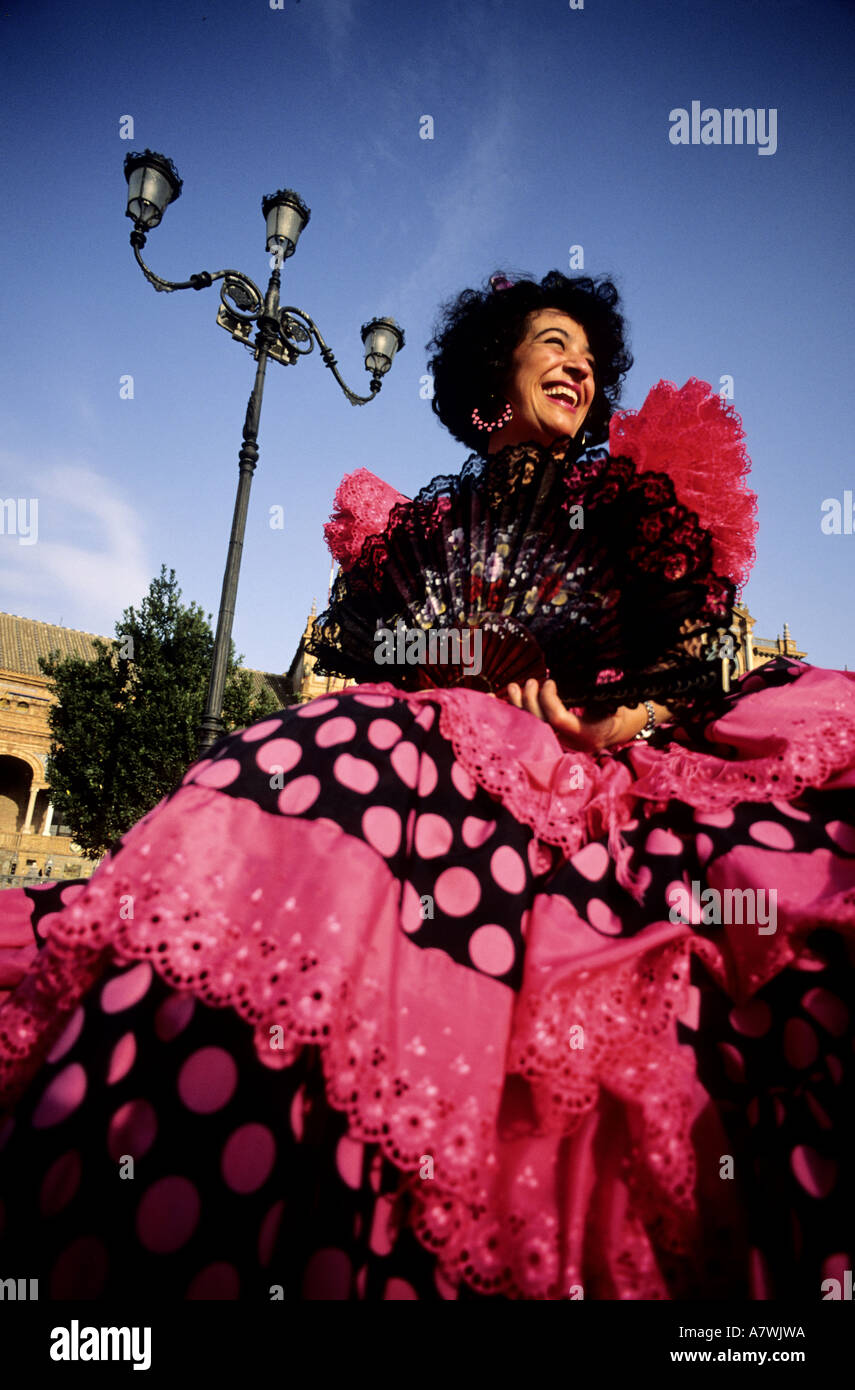 Spain, Andalusia, Sevilla, young woman wearing a traditional costume in ...