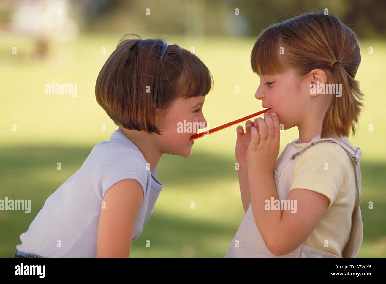 Children sharing sweets hi-res stock photography and images - Alamy
