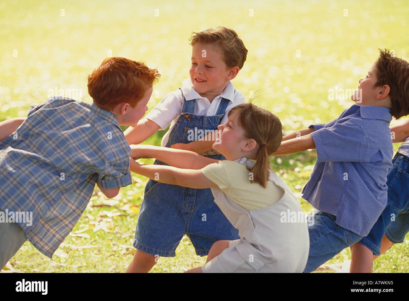 group of children pulling a rope Stock Photo - Alamy