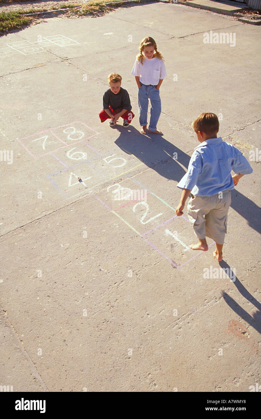group of children playing hopscotch Stock Photo - Alamy