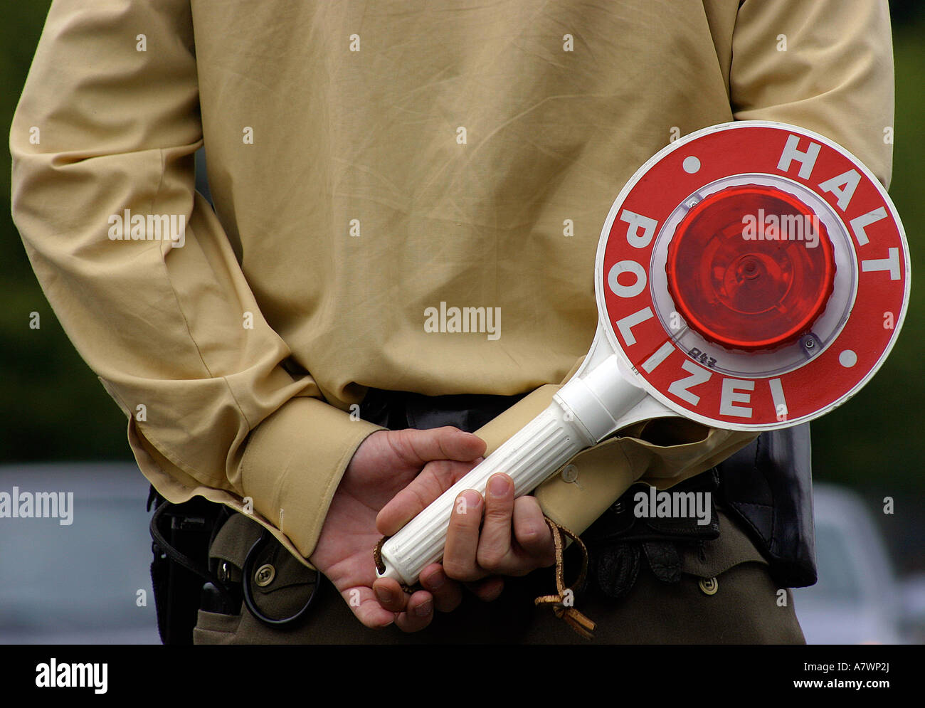 Police officer with "Halt, Polizei" sign Stock Photo - Alamy