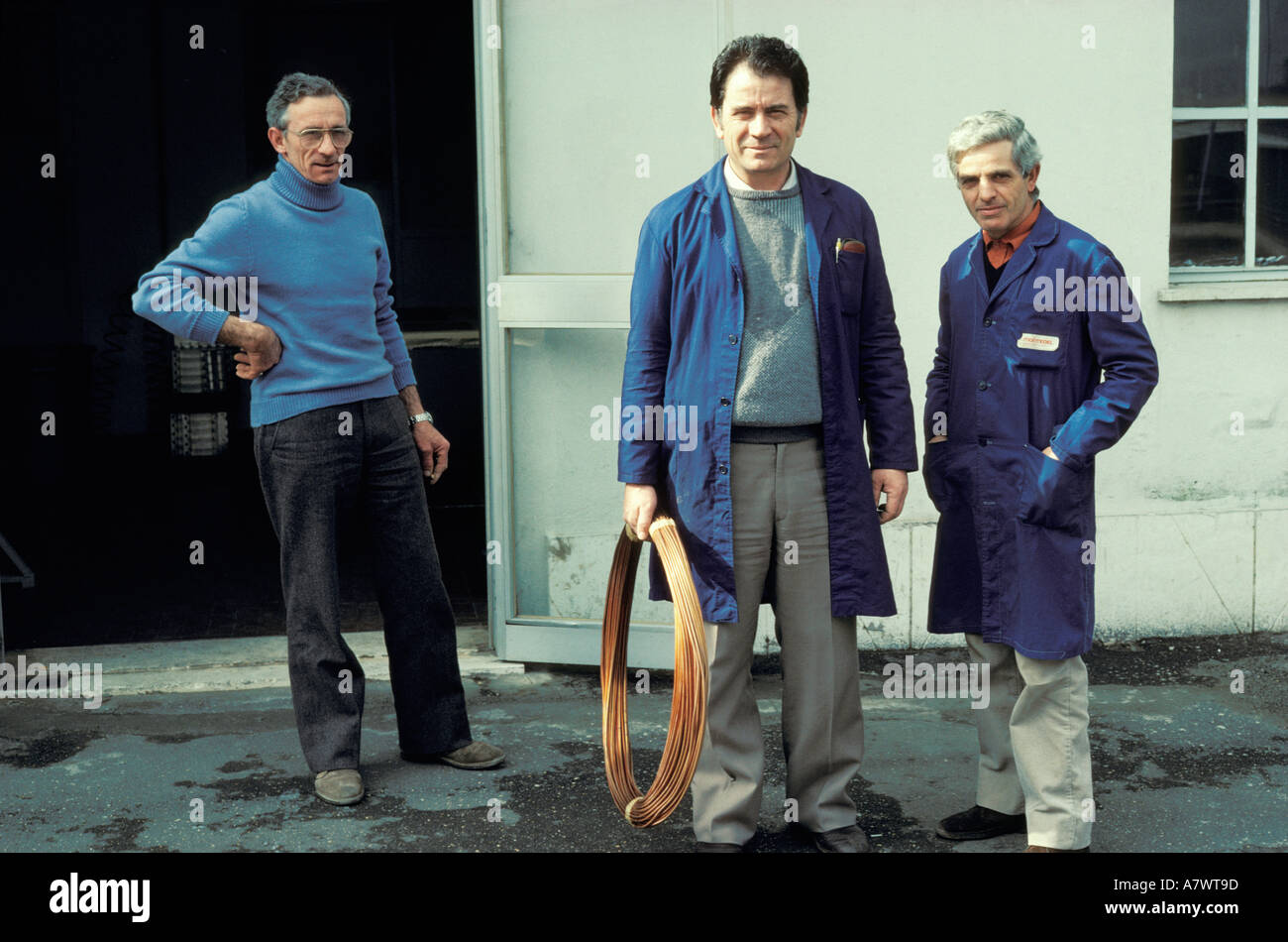 three Italian factory workers at electronics plant near Rome Italy ...