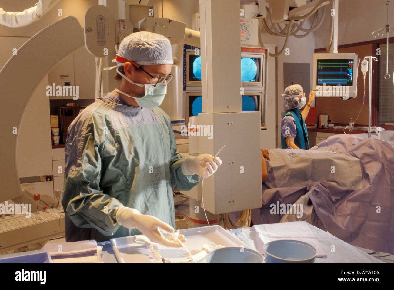 physician technician hospital catheter lab Stock Photo - Alamy