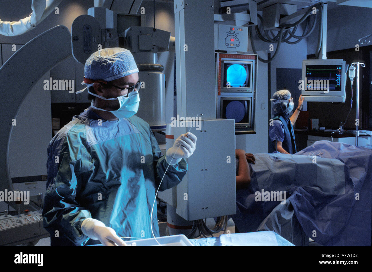 physician technician hospital catheter lab Stock Photo - Alamy