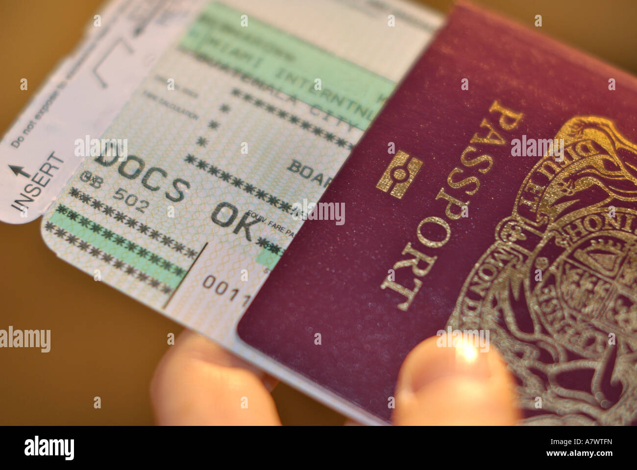 Biometric passport and DOCS OK boarding pass in passengers hand Stock ...