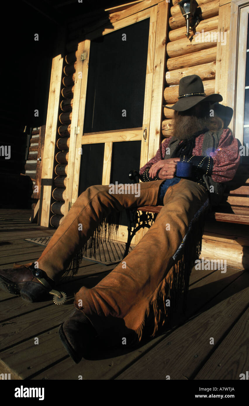 United States, Colorado, Rockies Cowboy Ranch, cowboy taking a nap in ...