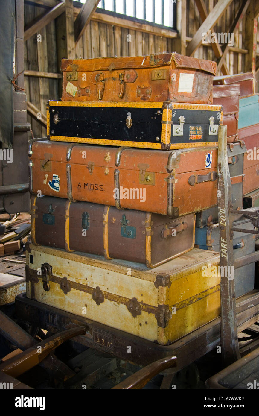 Old baggage suitcases and trunks on trolley at railway station JMH2802 ...