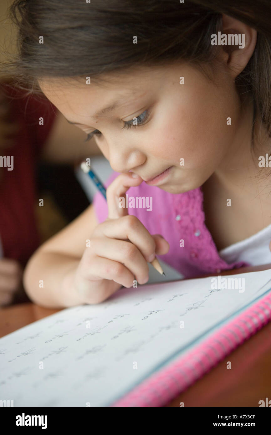 child working on math homework, closeup Stock Photo - Alamy
