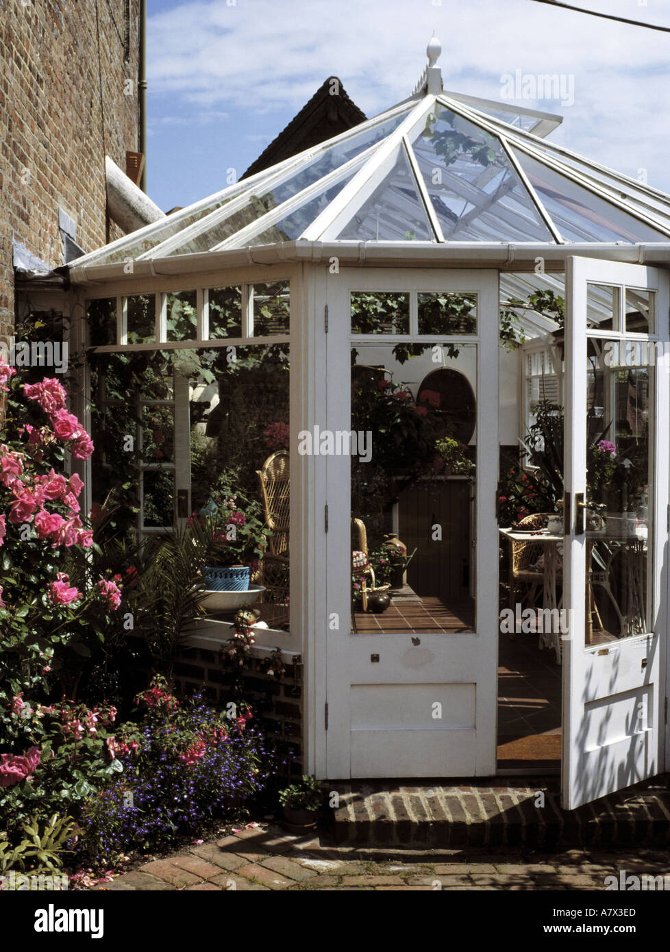 Traditional octagonal conservatory extension in summer Stock Photo - Alamy