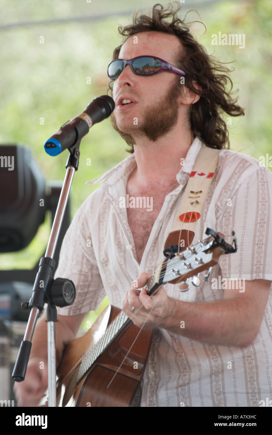 Celebrity music performing guitar on stage playing instrument hi-res ...