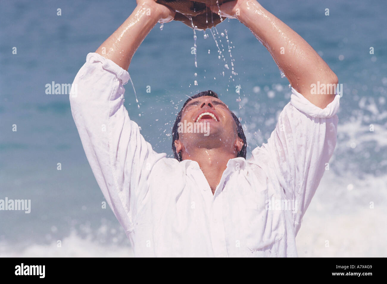 man refreshing cooling off his body with cold water Stock Photo - Alamy