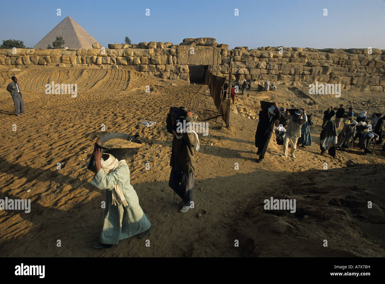 Egypt, Giza plateau, Workers near the gateway in the Wall of the Crow ...