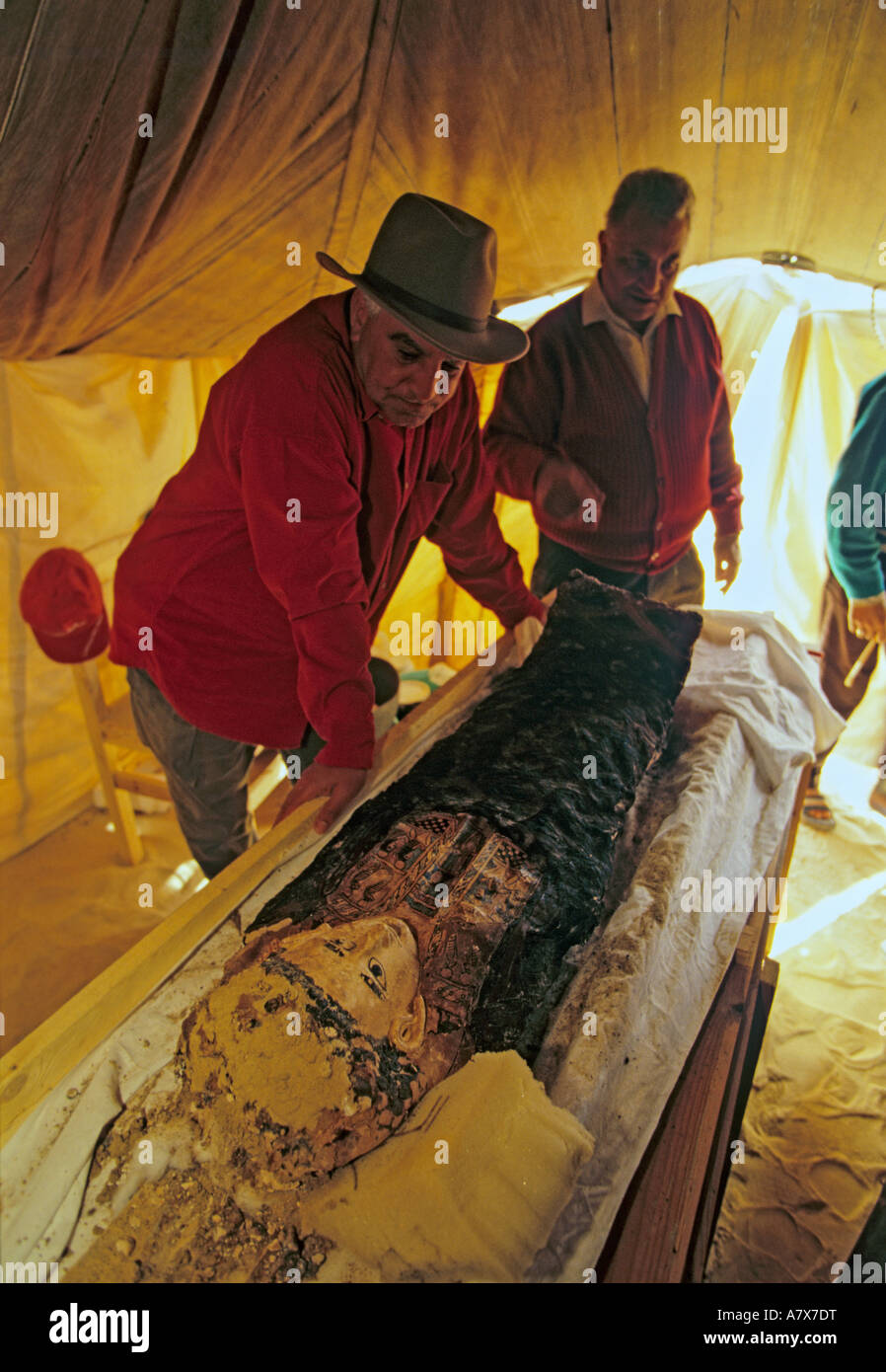 Egypt, Moustafa Abdul Qadar and Dr. Hawass look at mummy of little girl ...