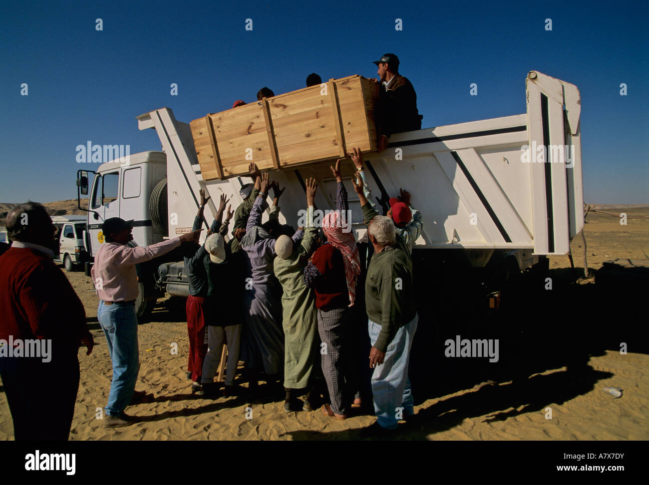 Egypt, Mr. X mummy from Tomb 55 is loaded in coffin on truck to Giza ...