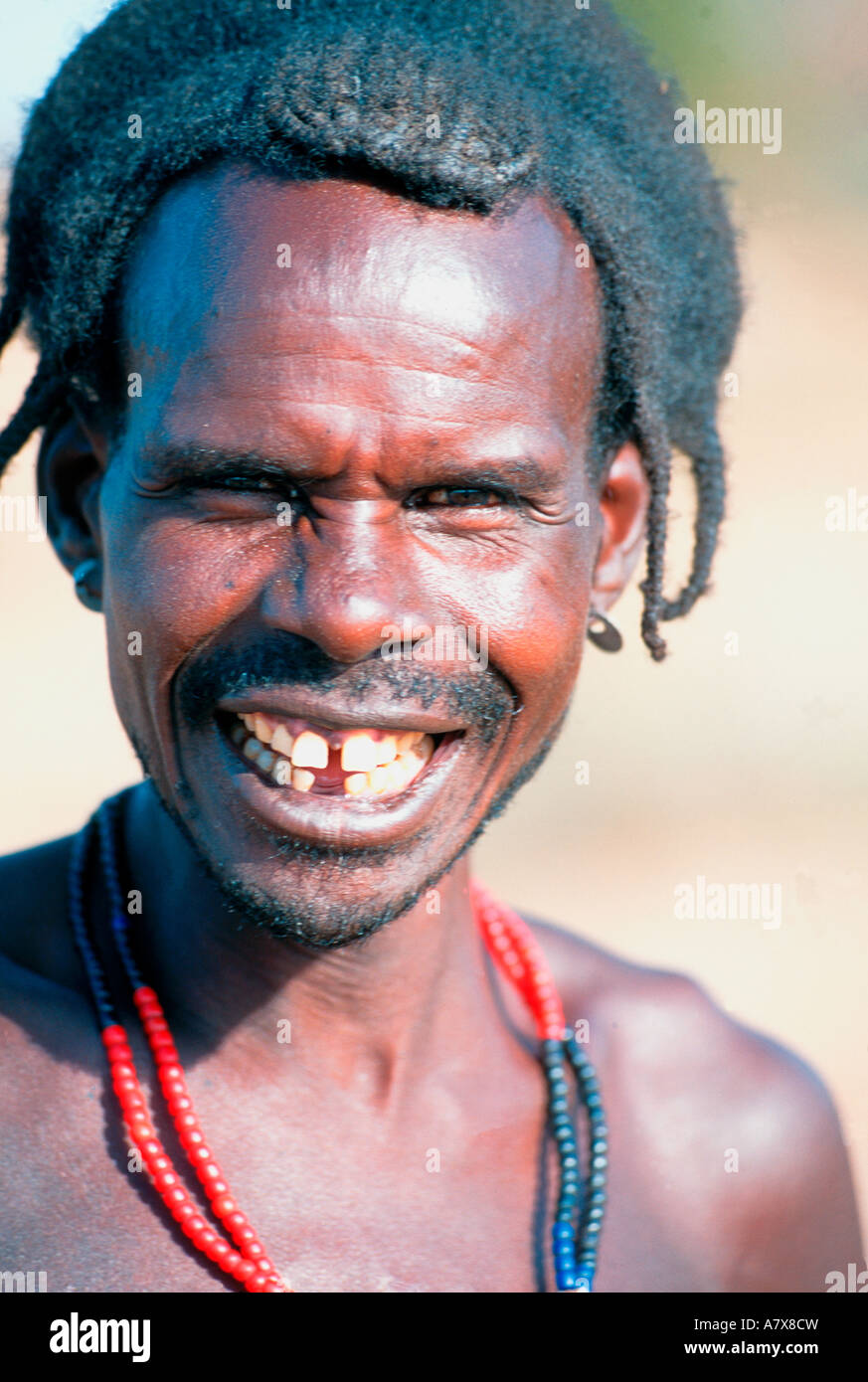 A Hamar man laughs with a toothy smile, in the Omo region of Ethiopia ...