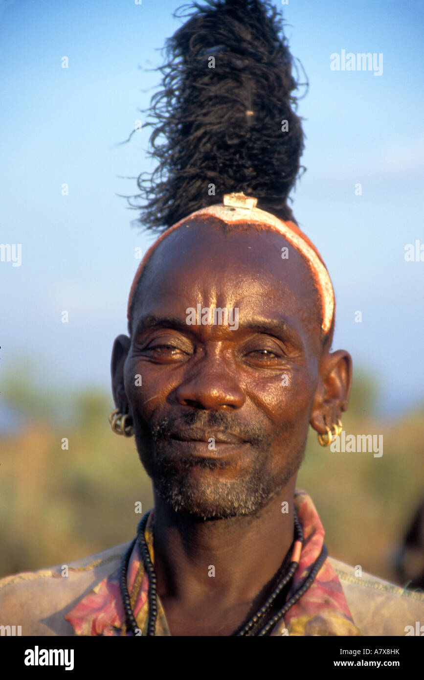 A Hamar man with a traditional Hamar tribal headdress in his village in ...