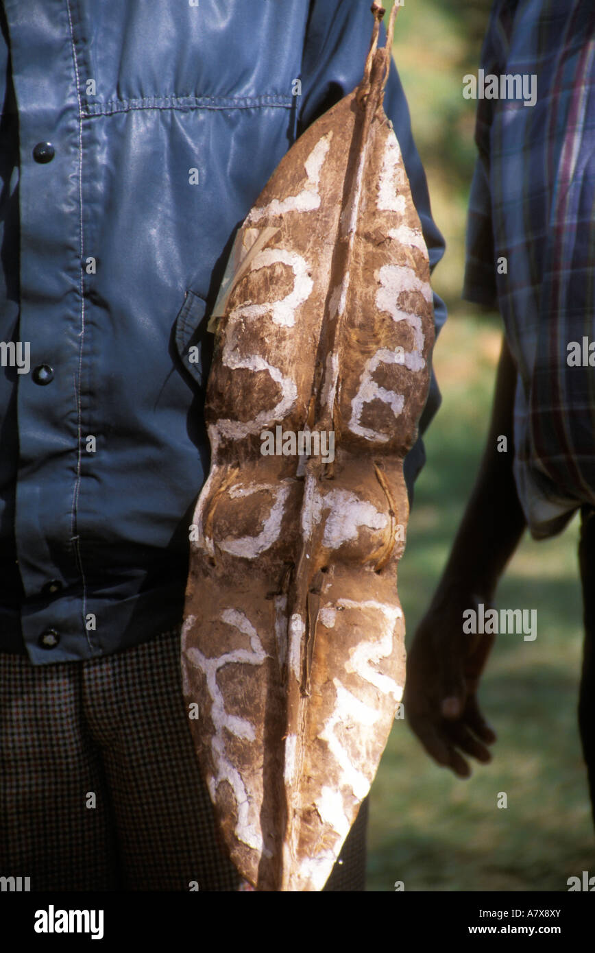 A Konso man displaying a traditional, painted shield, in the Omo region ...