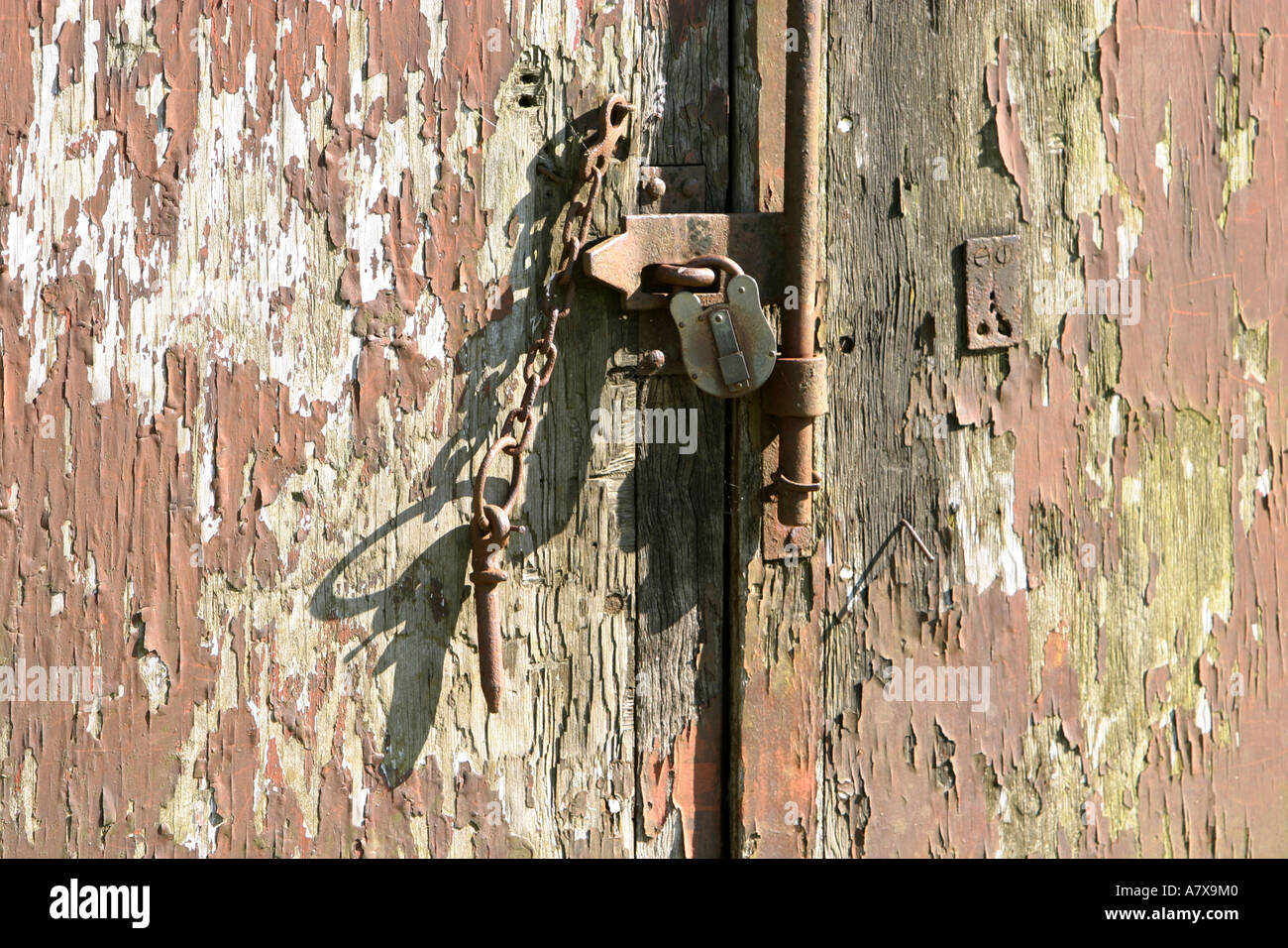 Storage container door securely padlocked and chained shut Stock Photo ...
