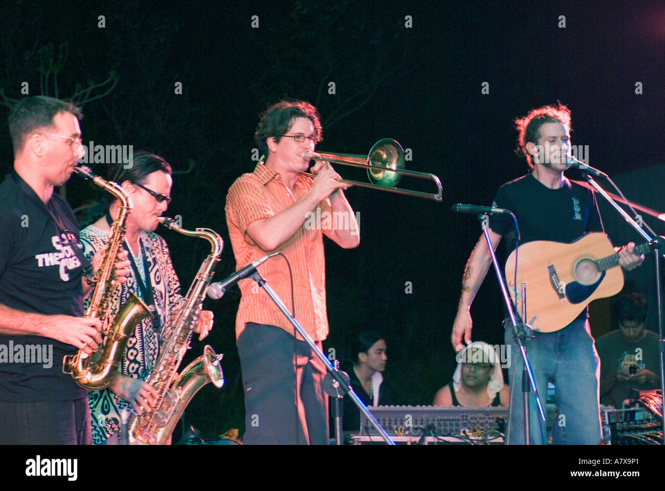 Celebrity music performing guitar on stage playing instrument hi-res ...