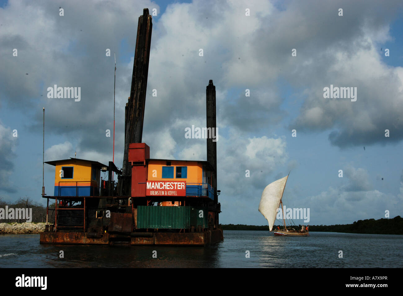 Kenya: Lamu, Manda Bay Channel, workboat dredging the coastal mangrove ...