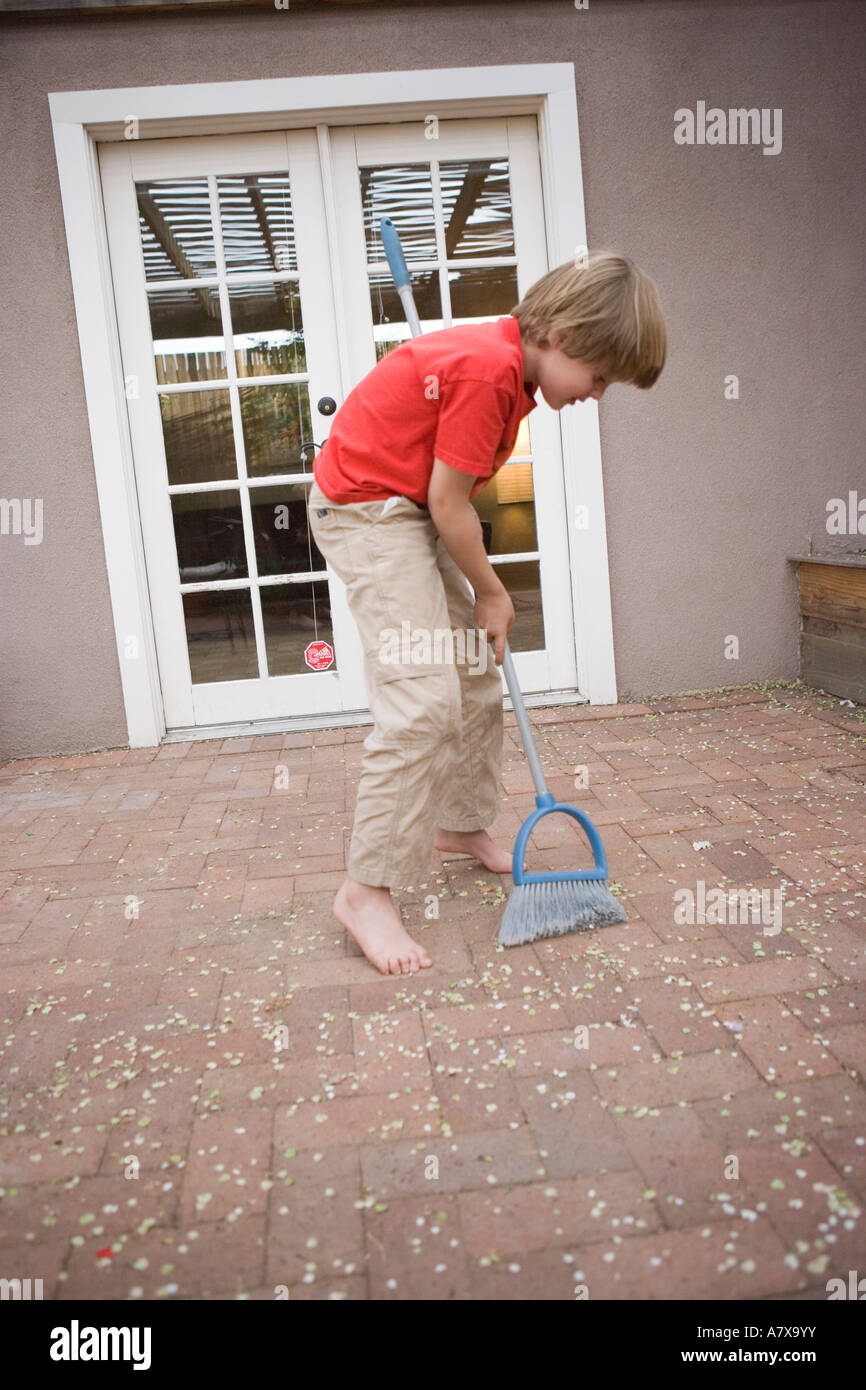 Child sweeping school hi-res stock photography and images - Alamy