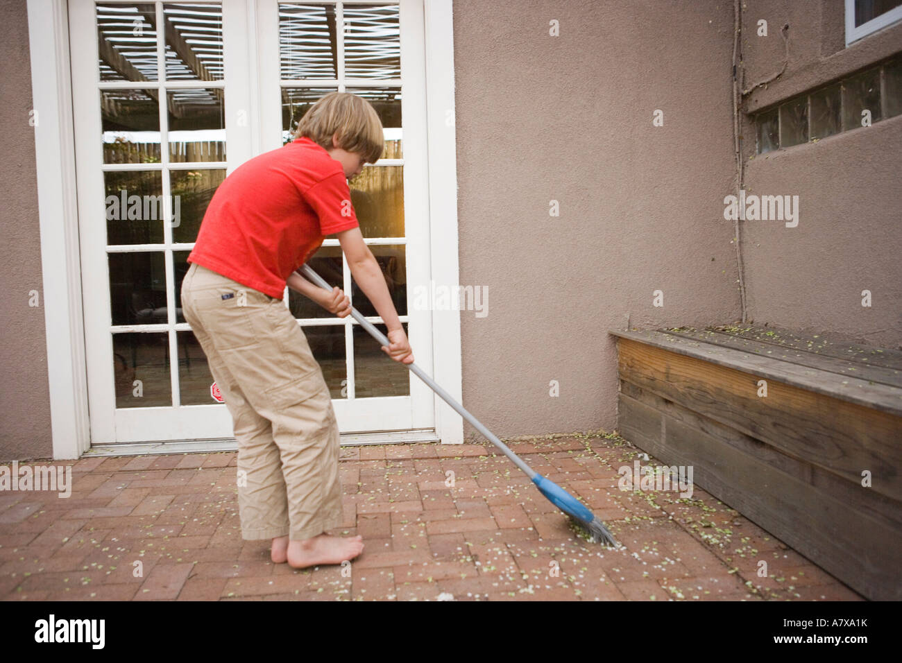 Child sweeping school hi-res stock photography and images - Alamy