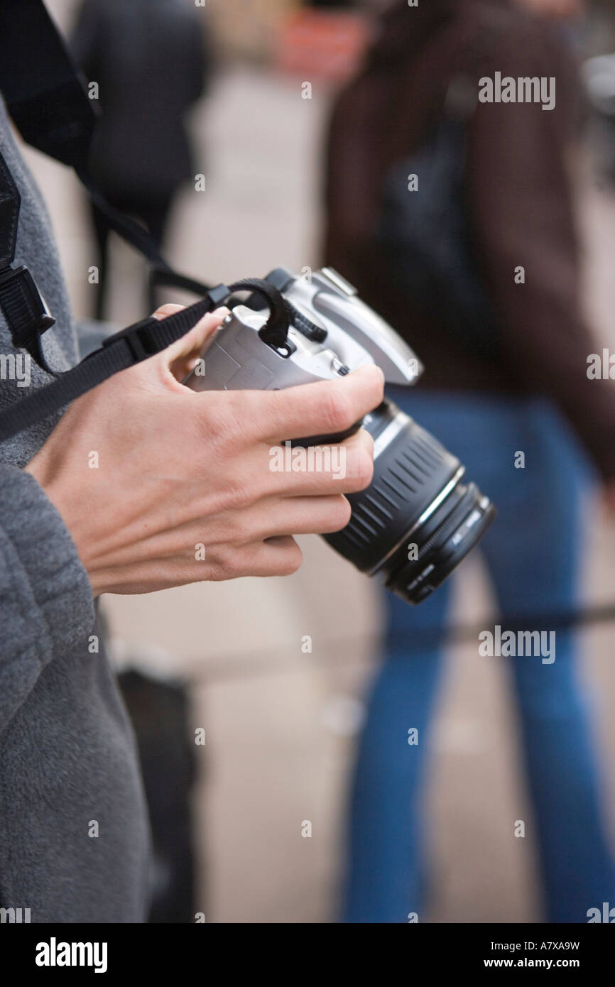 close up of hands holding camera Stock Photo - Alamy