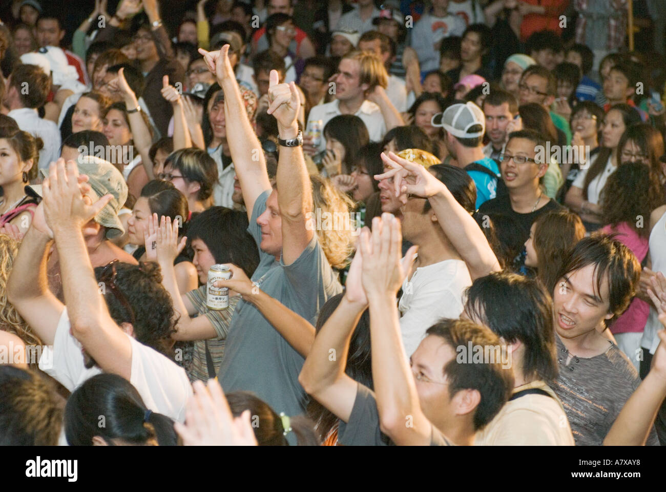 Multiethnic crowd of people listening to and watching live Spring ...