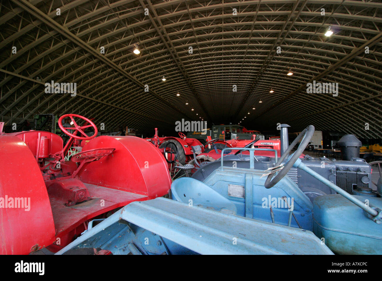 Tractors and old farm machinery displayed in agricultural museum Stock ...