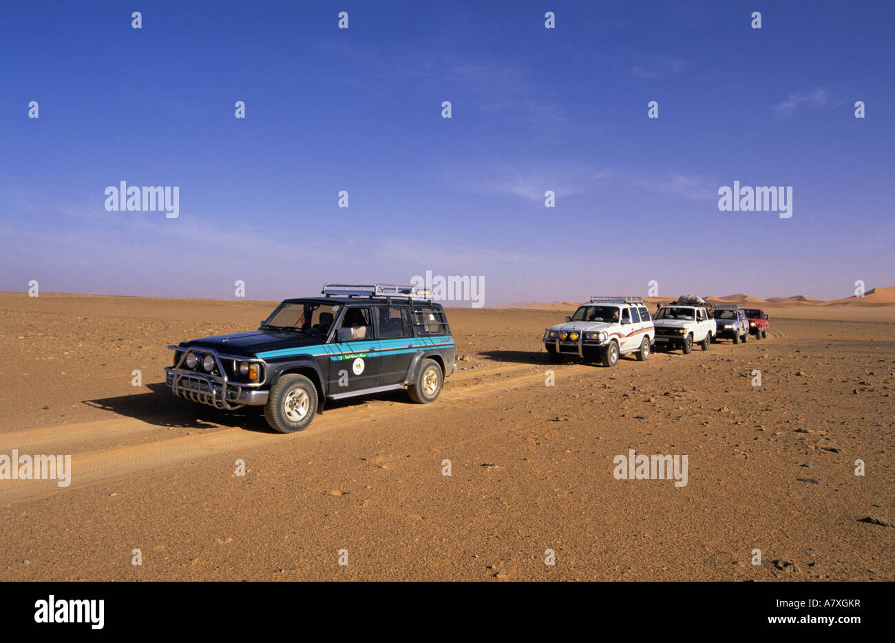Libya, Fezzan, Sahara desert, Erg Murzuq, Jeeps driving through desert ...