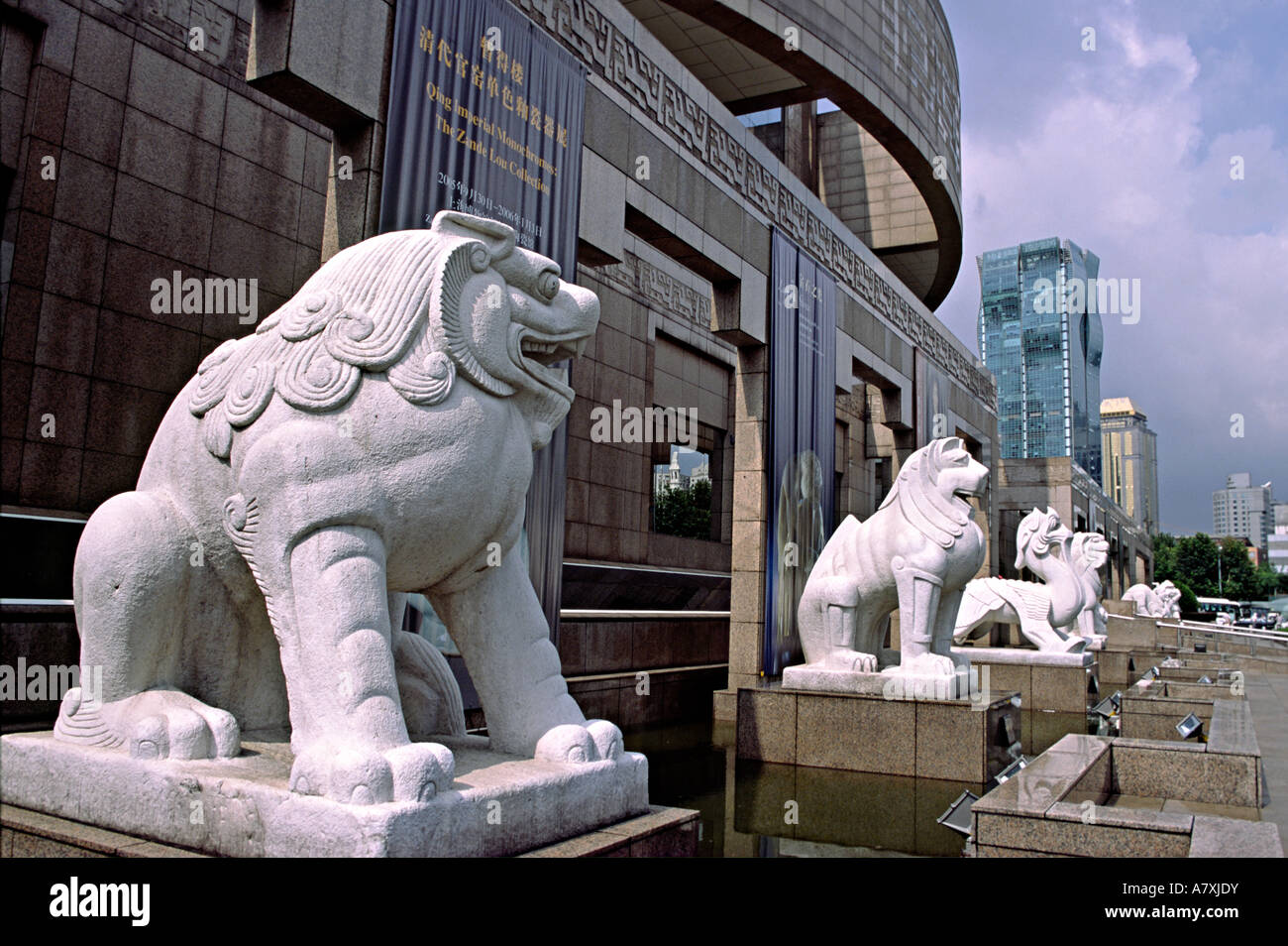 Asia, China, Shanghai. Lion and mythical beast sculptures guard main ...