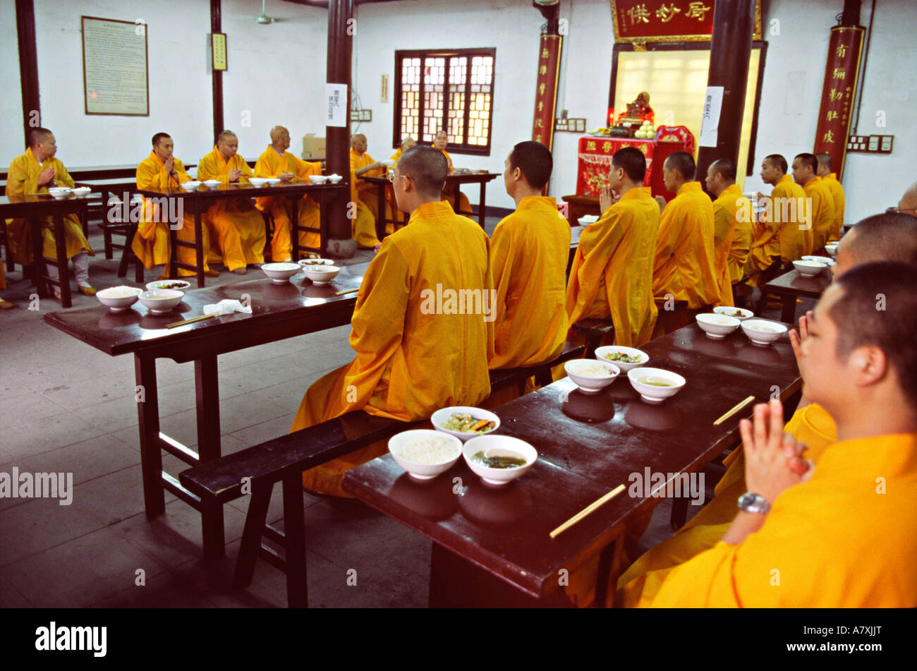 Asia, China, Shanghai. Monks lunch in dining hall at Longhua Temple and ...